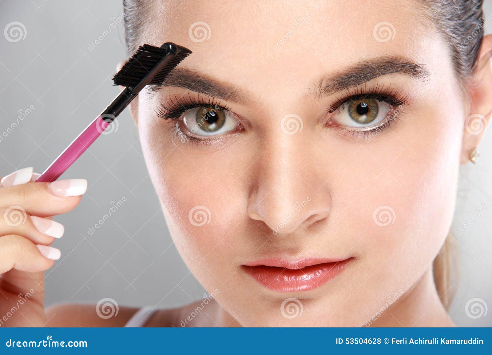 Beautiful Caucasian Model Using an Eyebrow Brush Stock Photo - Image of ...