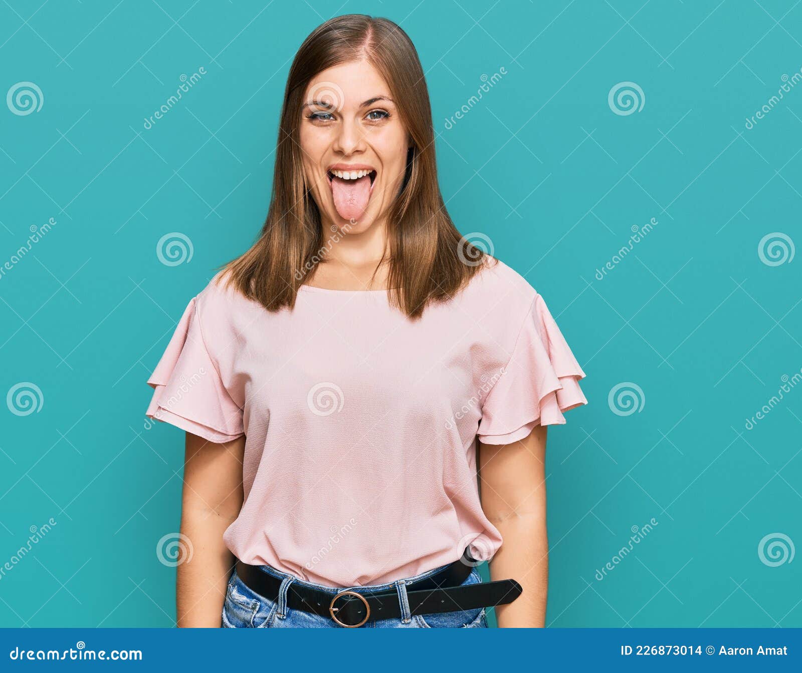 Beautiful Caucasian Woman Wearing Casual Clothes Sticking Tongue Out