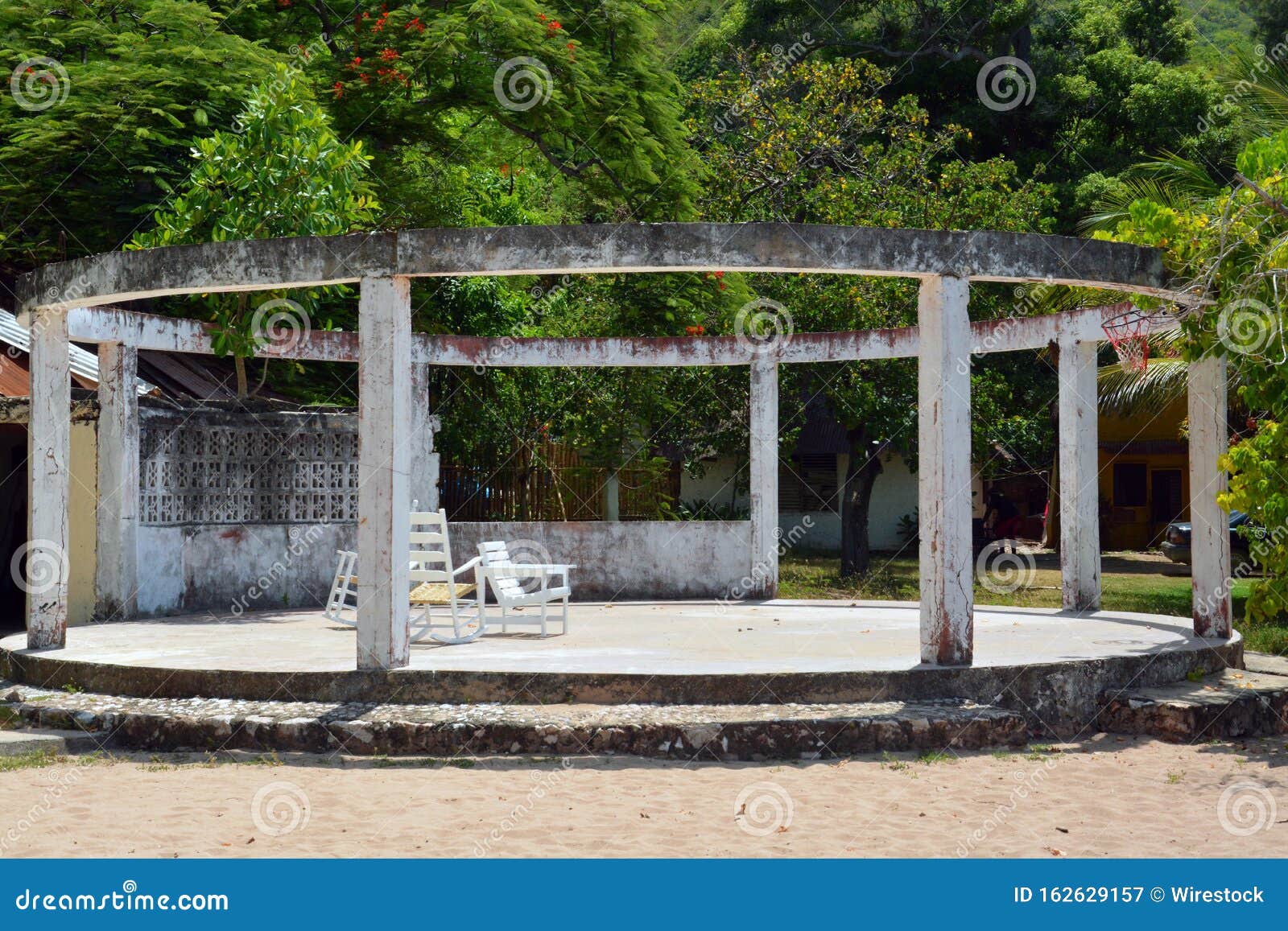 Beautiful Cement Platform with Plastic Chairs with Trees and Houses in ...