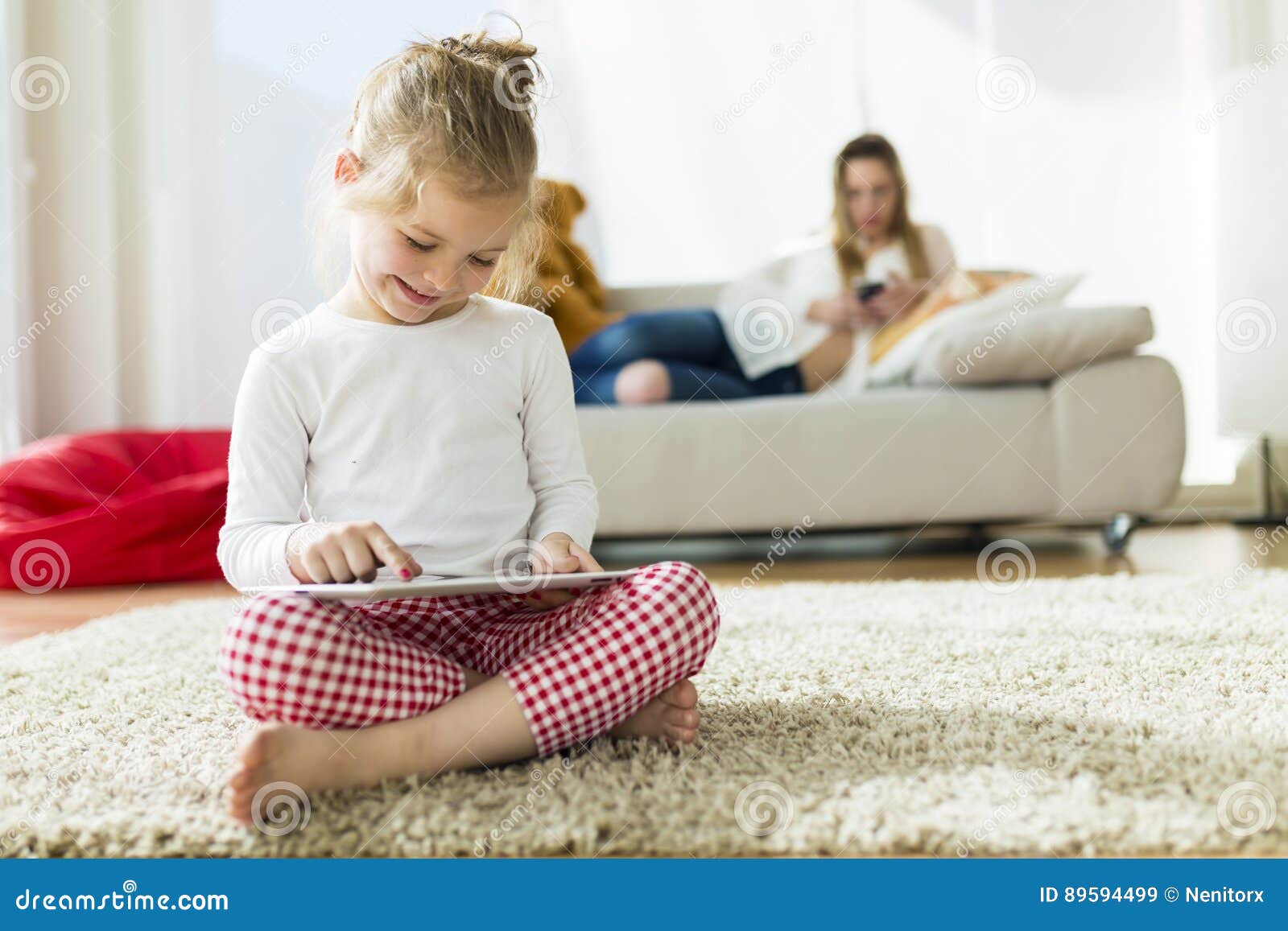 Beautiful Child Playing with Digital Tablet at Home. Stock Image ...