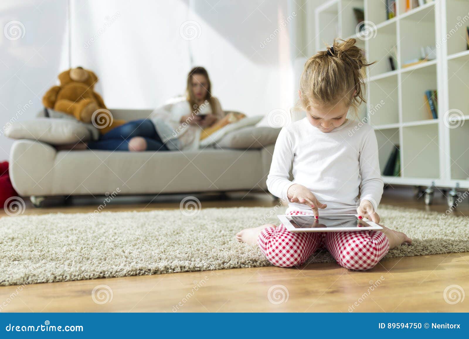 Beautiful Child Playing with Digital Tablet at Home. Stock Photo ...