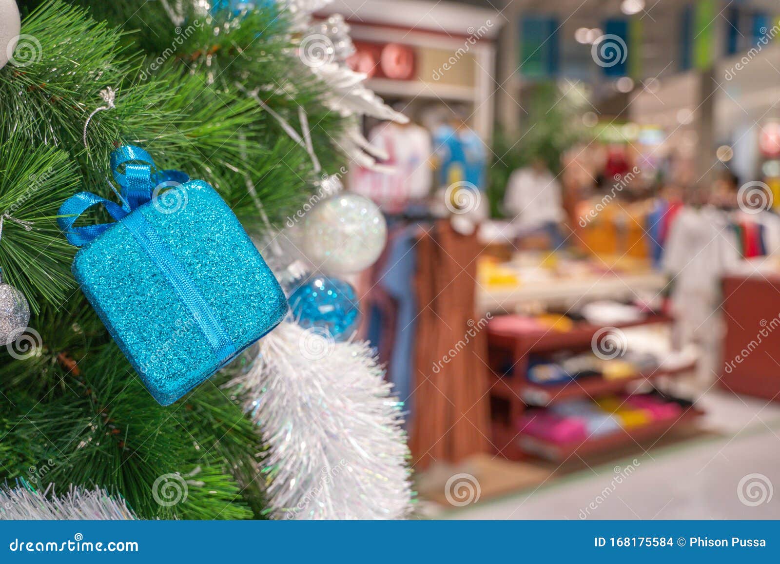Christmas Gift Boxes Hanging from a Decorated Christmas Tree Stock ...
