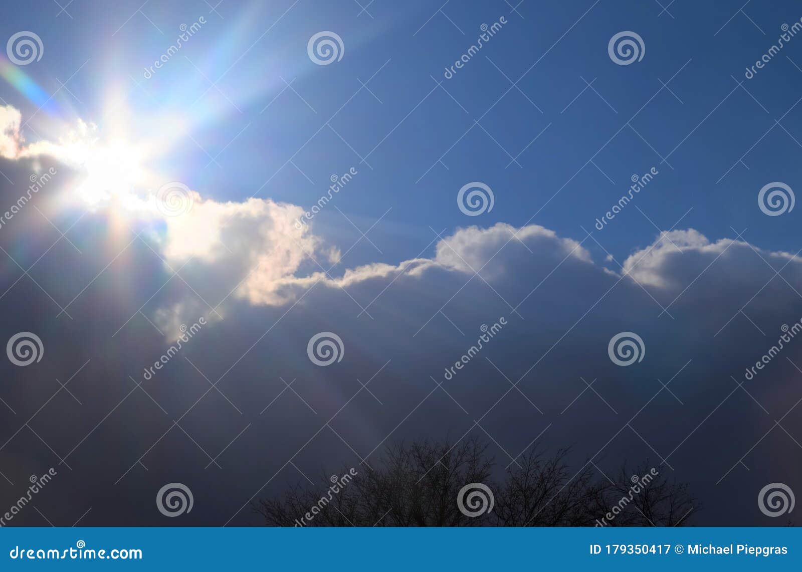 Beautiful Cloud Formations with Sunlight Beam Shining in a Sunset Sky ...