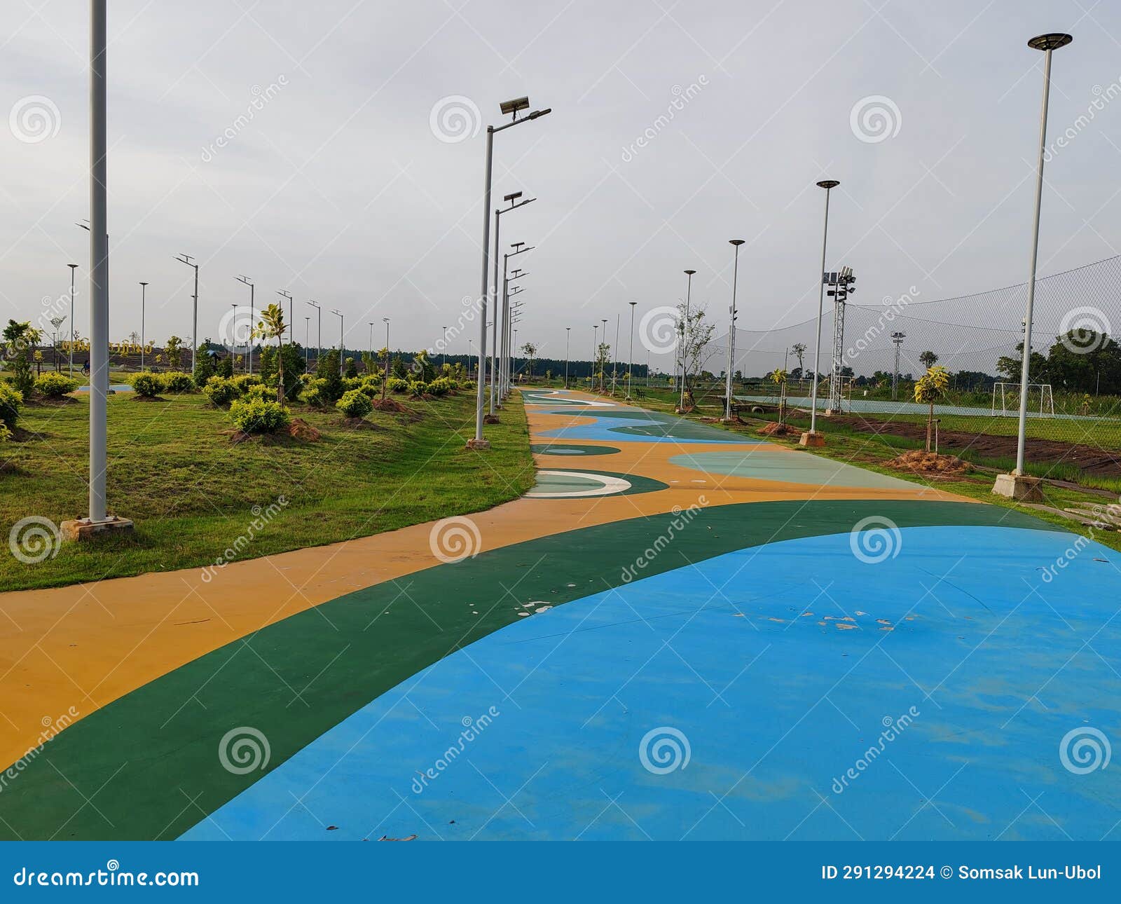 Beautiful Colored Road in Public with Green Grass and Sky. Stock Photo ...
