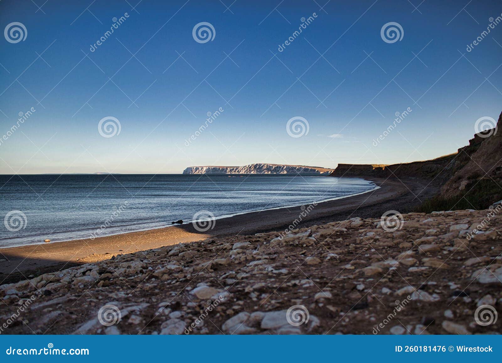 Beautiful Compton Beach with Calm Waves Under a Blue Sky Stock Photo ...