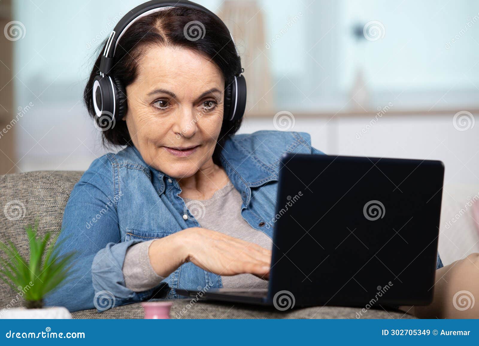 Beautiful Concentrated Middle Aged Woman on Generic Laptop Computer ...