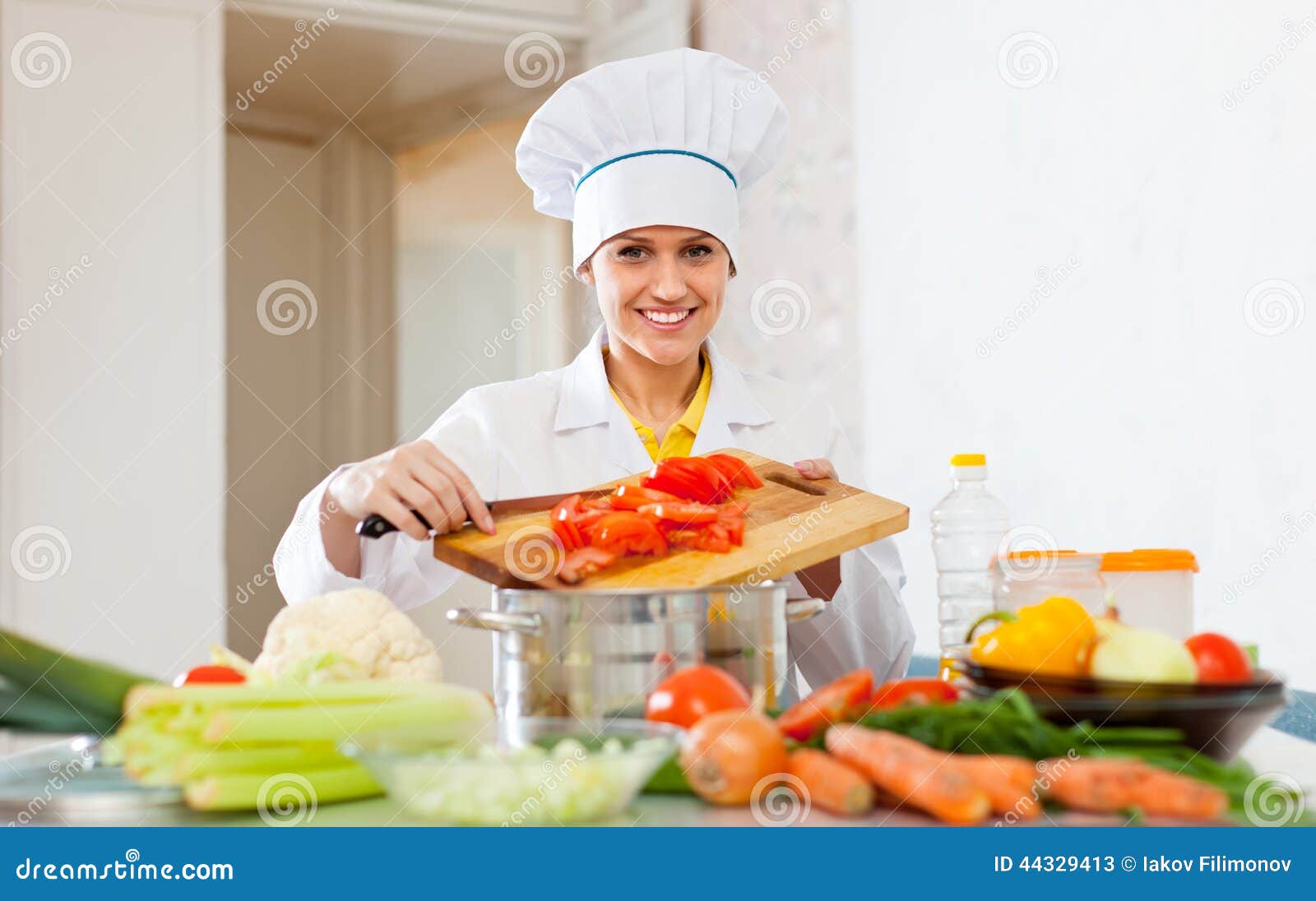 Beautiful Cook Woman In Uniform Prepares Veggie Lunch Stock Image