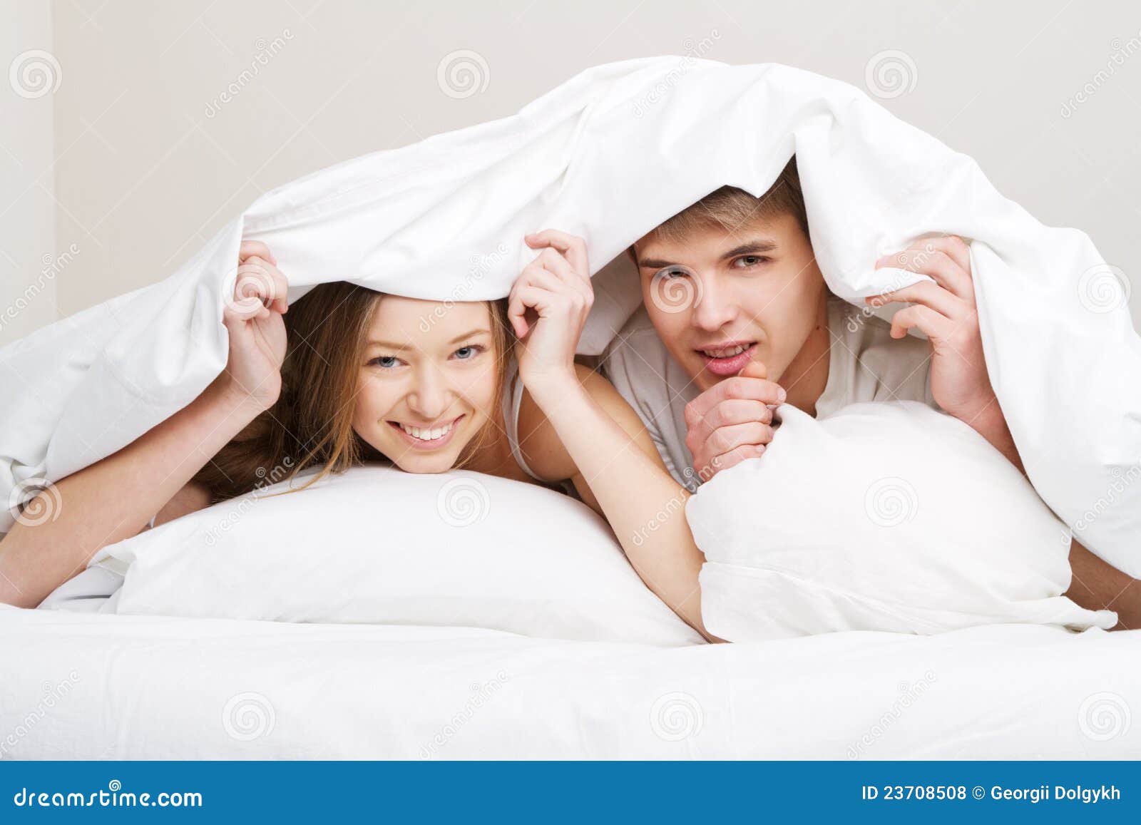 Beautiful couple in bed stock photo. Image of couple - 23708508