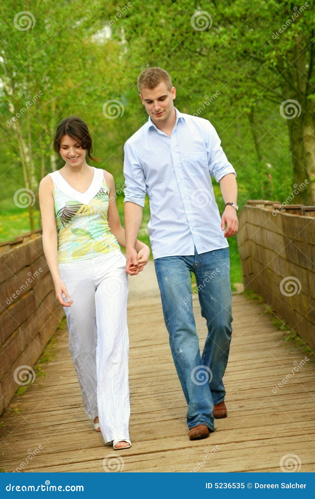 Beautiful Couple on a Bridge Stock Image - Image of male, green: 5236535