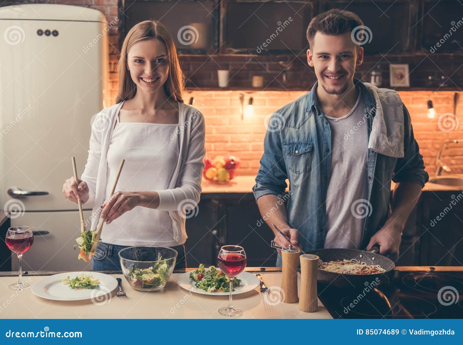 Beautiful couple cooking stock image. Image of healthy - 85074689