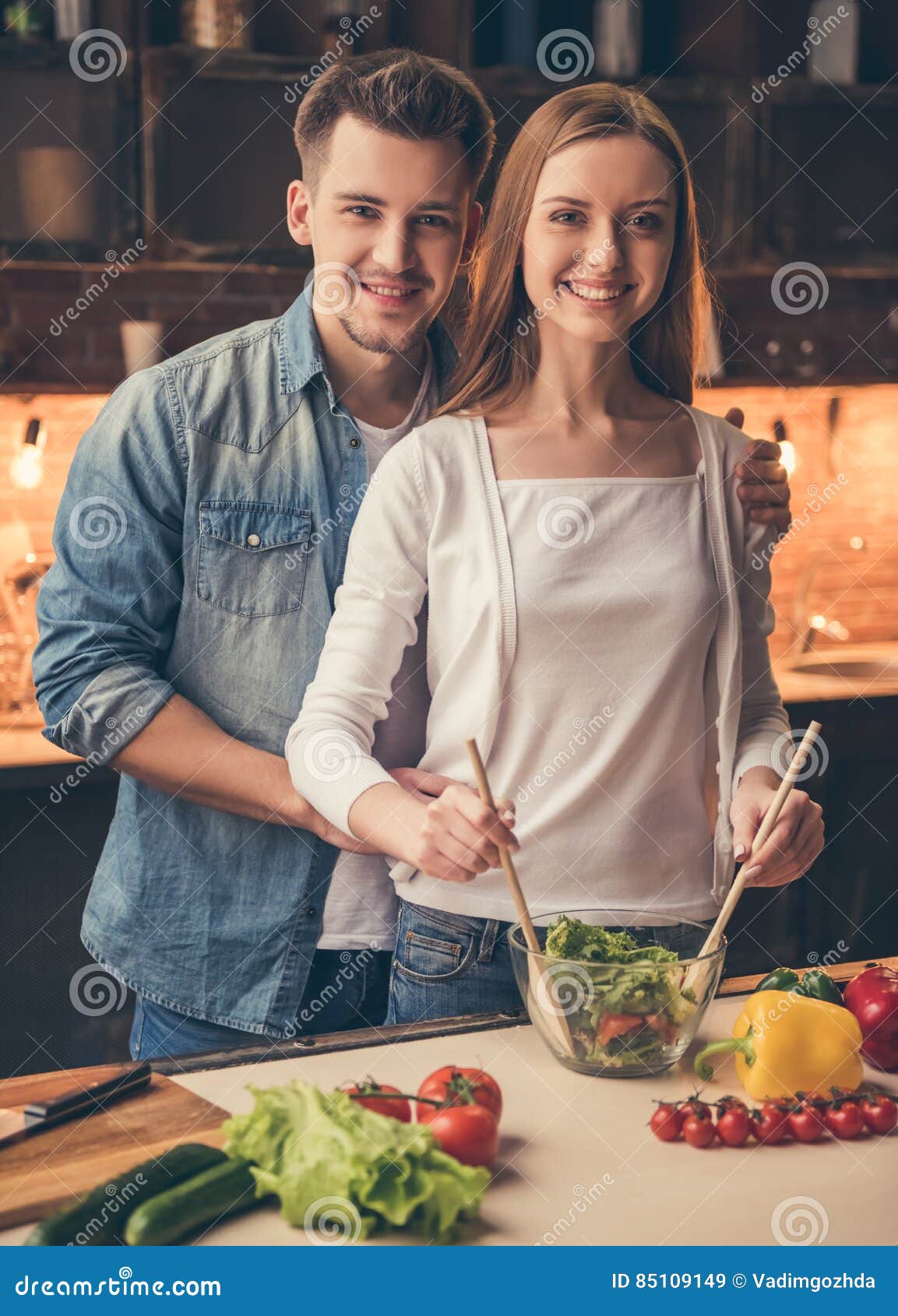 Beautiful couple cooking stock image. Image of family - 85109149
