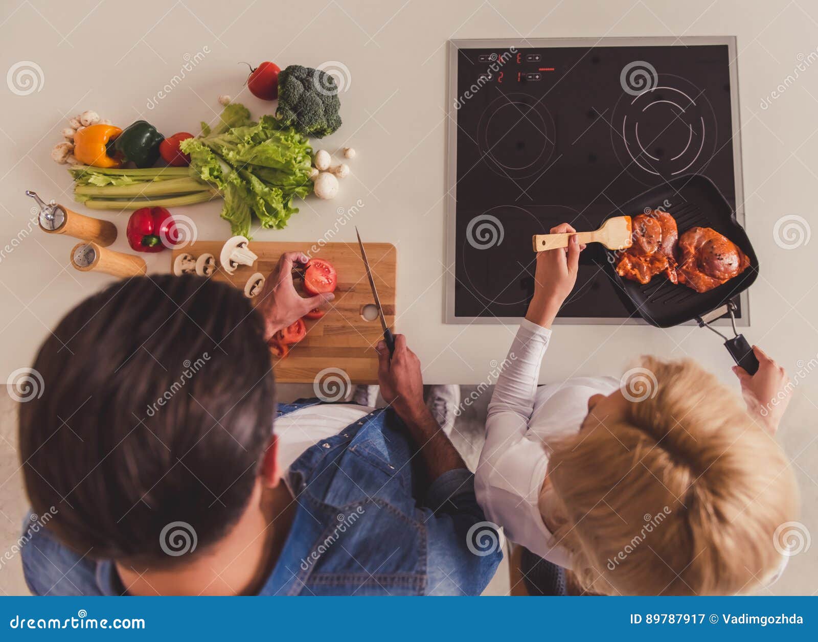Beautiful couple cooking stock image. Image of girl, frying - 89787917