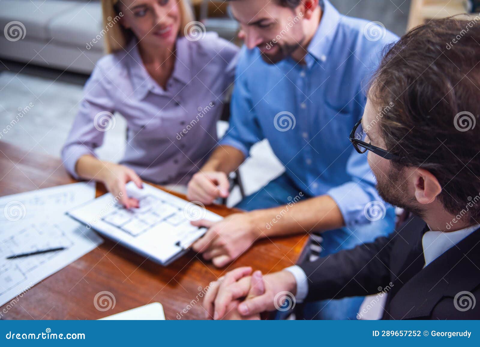 Couple and a realtor stock photo. Image of businessman - 289657252