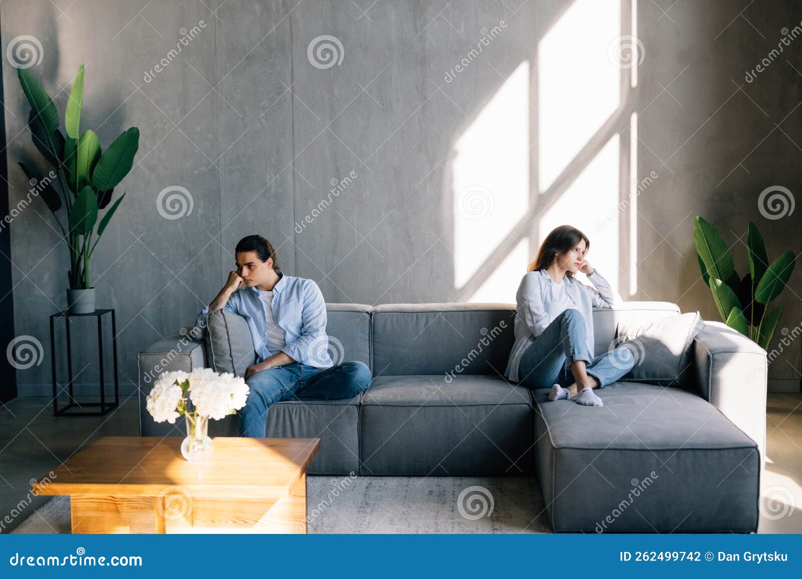 Beautiful Couple Is Having A Quarrel While Sitting On Sofa At Home