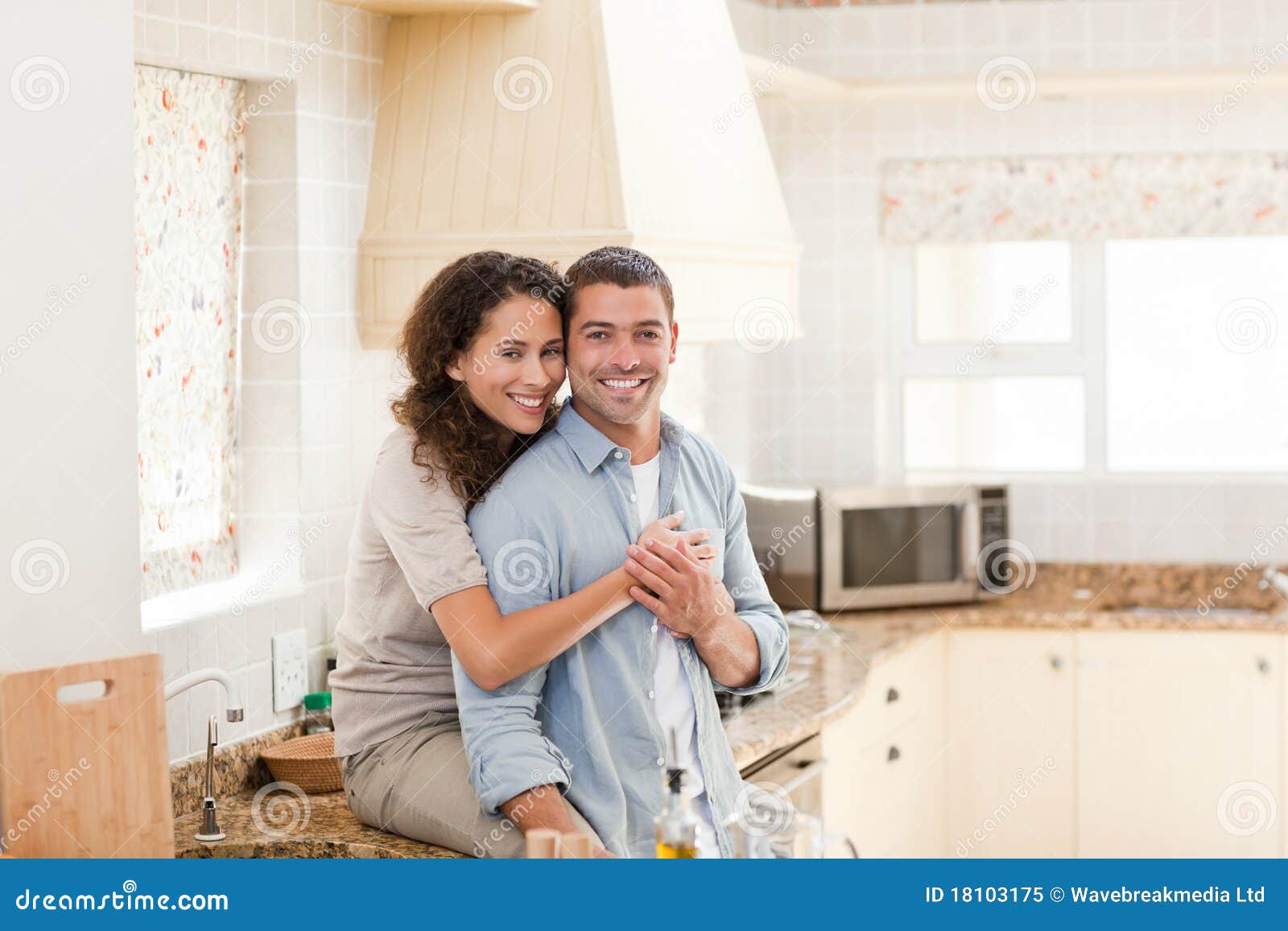 Beautiful Couple Hugging in the Kitchen Stock Image - Image of casual ...