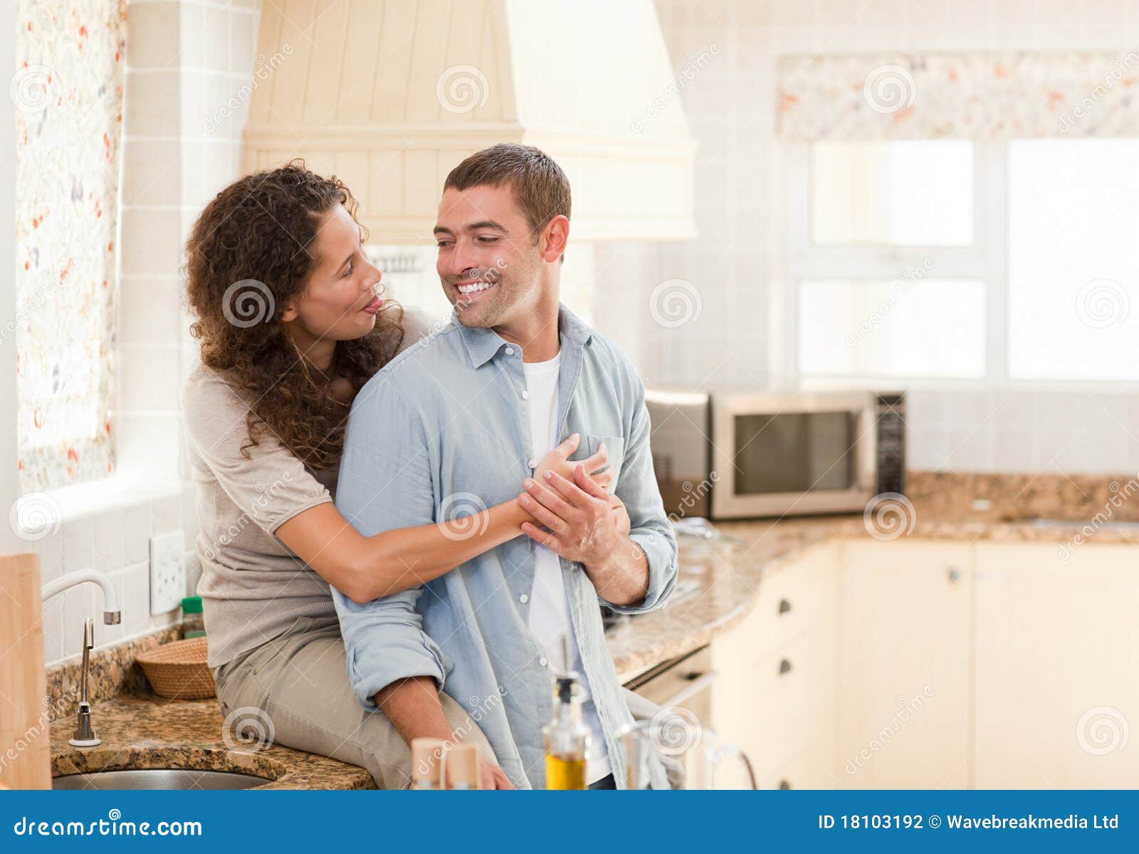 Beautiful Couple Hugging in the Kitchen Stock Photo - Image of food ...