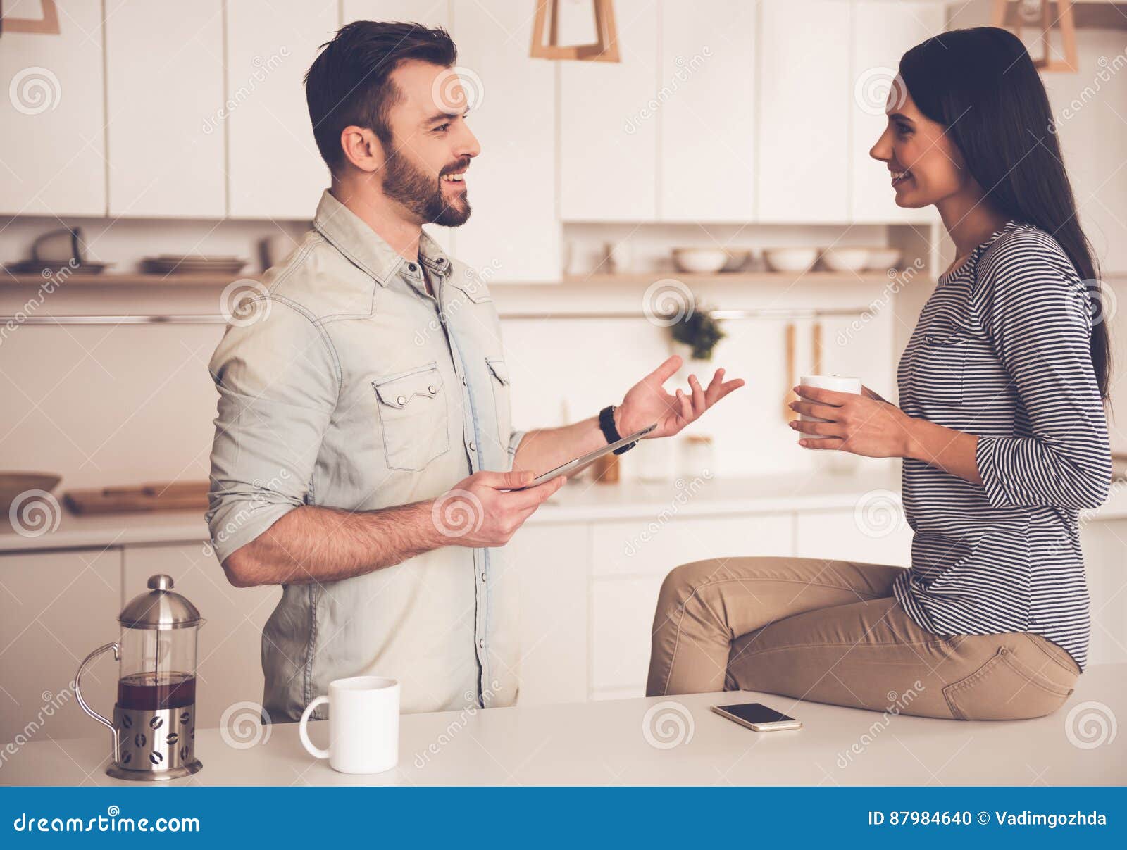 Beautiful Couple in Kitchen Stock Photo - Image of coffee, happy: 87984640