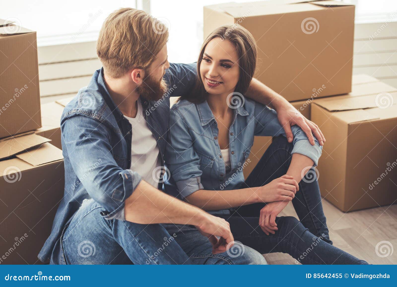 Beautiful couple moving stock image. Image of investment - 85642455