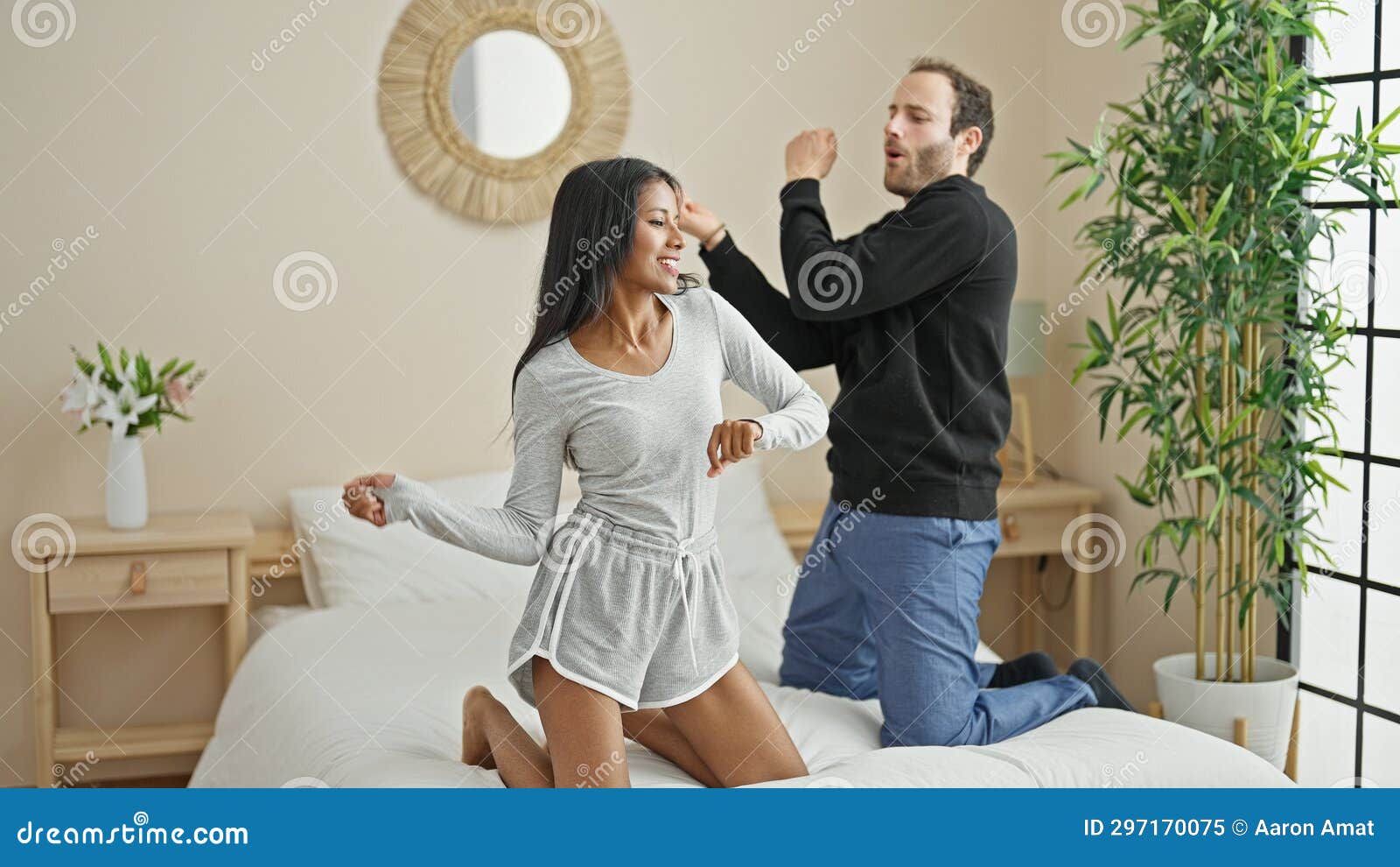 Beautiful Couple Sitting on Bed Dancing at Bedroom Stock Image - Image ...