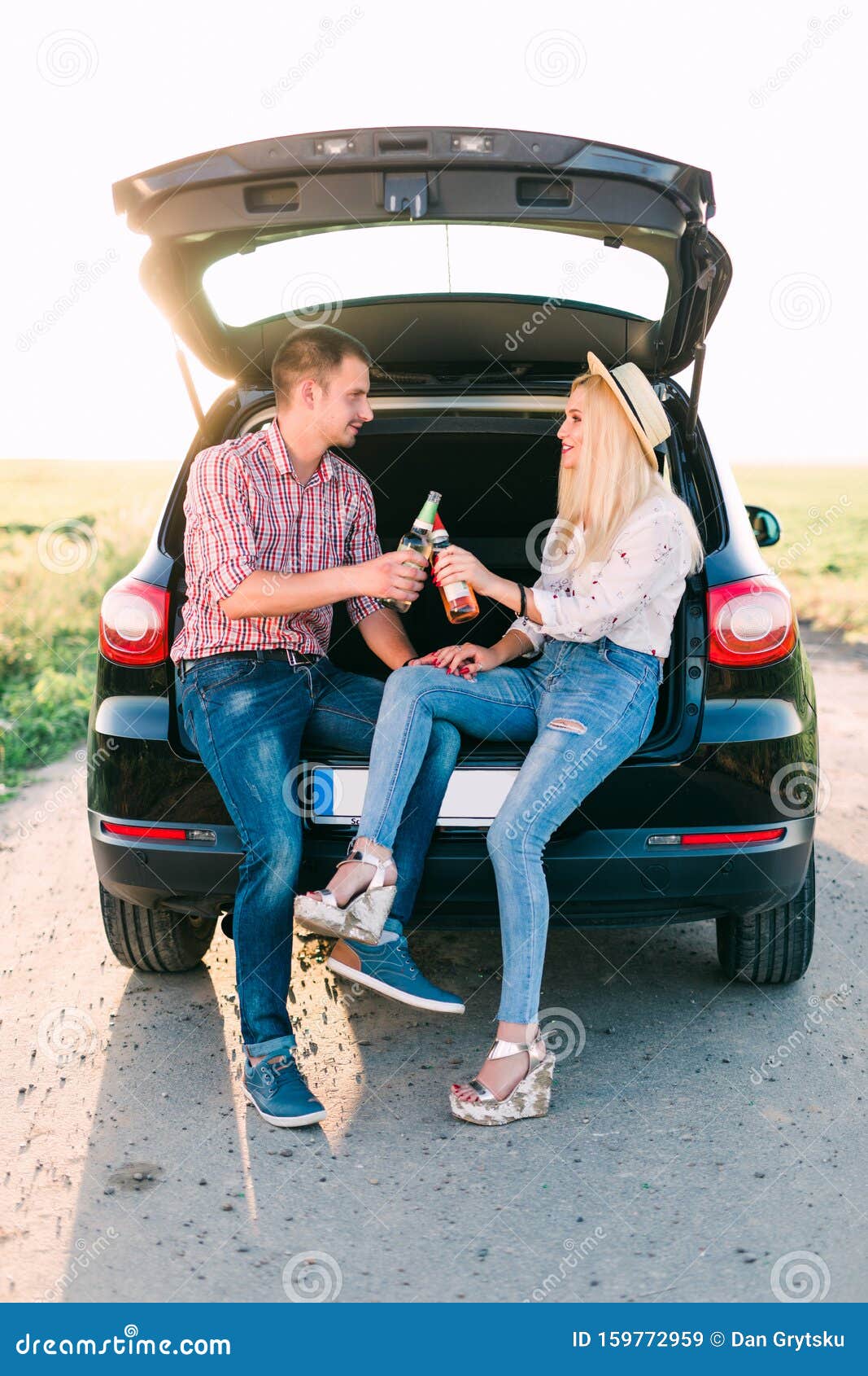 Beautiful Young Couple Sitting Drink Cold Drinks in Car Trunk Stock ...