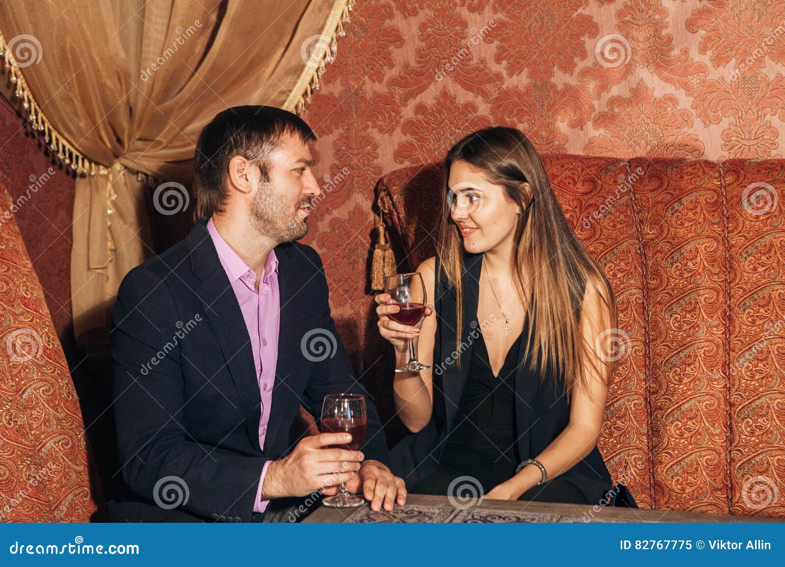 Beautiful Couple Sitting in a Fancy Restaurant and Talking Stock Image ...