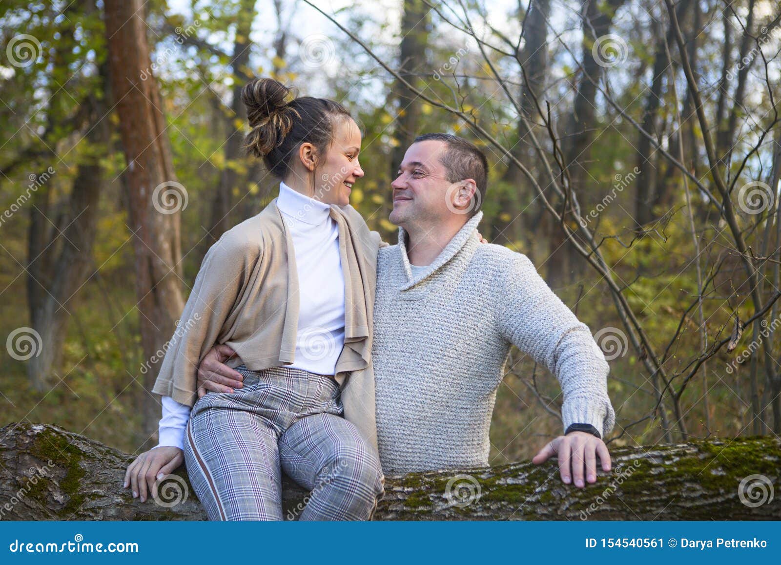 Beautiful Couple Sitting on the Tree in Park Hugging Stock Image ...