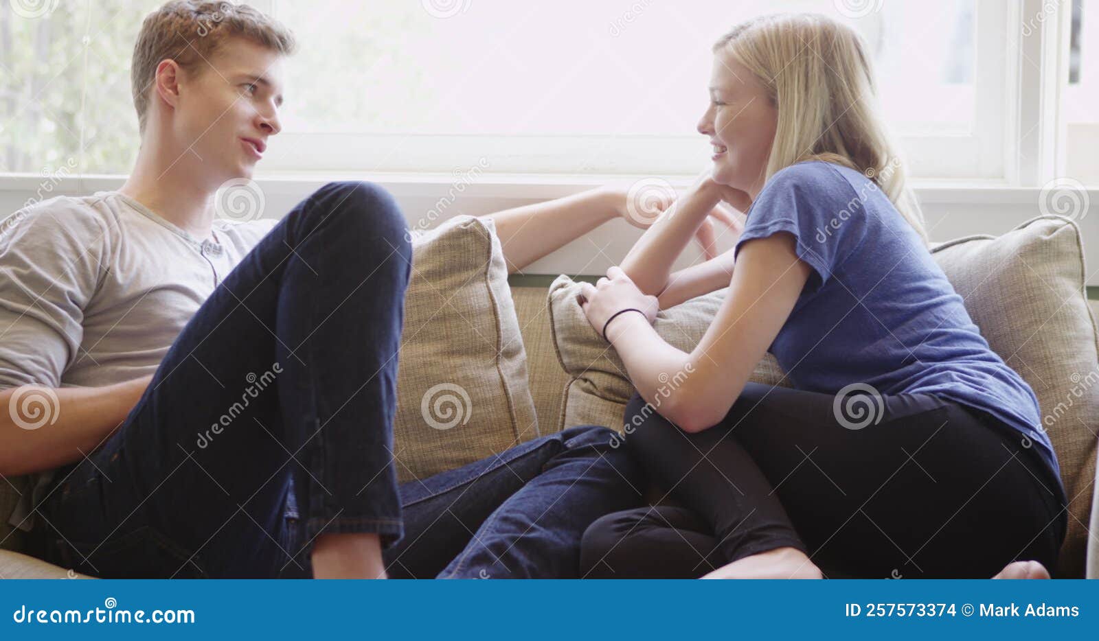 Beautiful Couple Talking Together on Couch Stock Footage - Video of ...