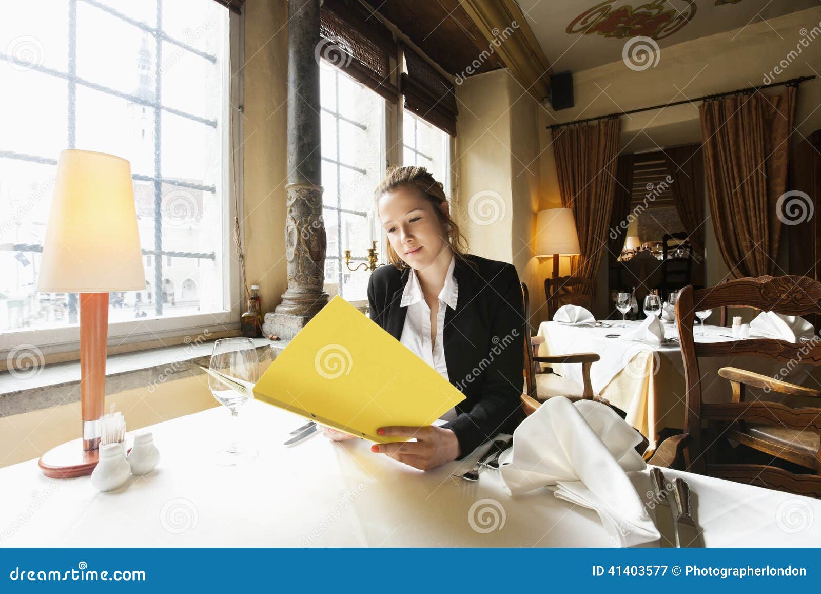 Beautiful Customer Reading Menu at Restaurant Table Stock Image - Image ...