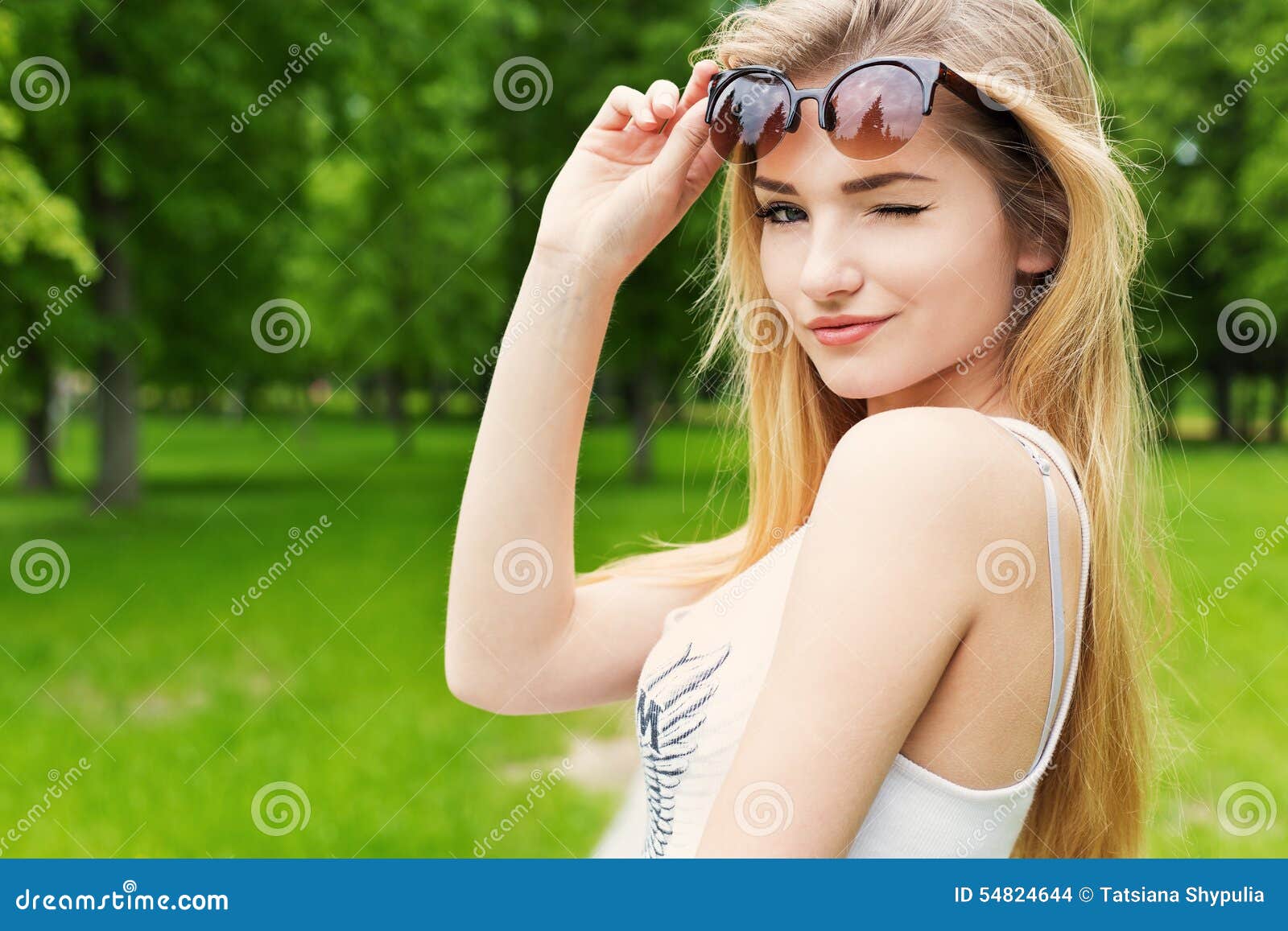Beautiful Cute Happy Girl With Blond Long Hair In White T Shirt Lifted