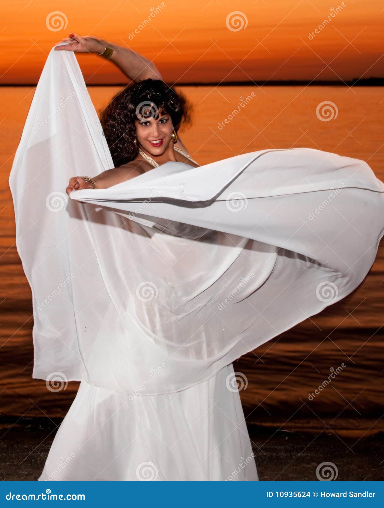 Beautiful dancer at sunset stock photo. Image of white - 10935624