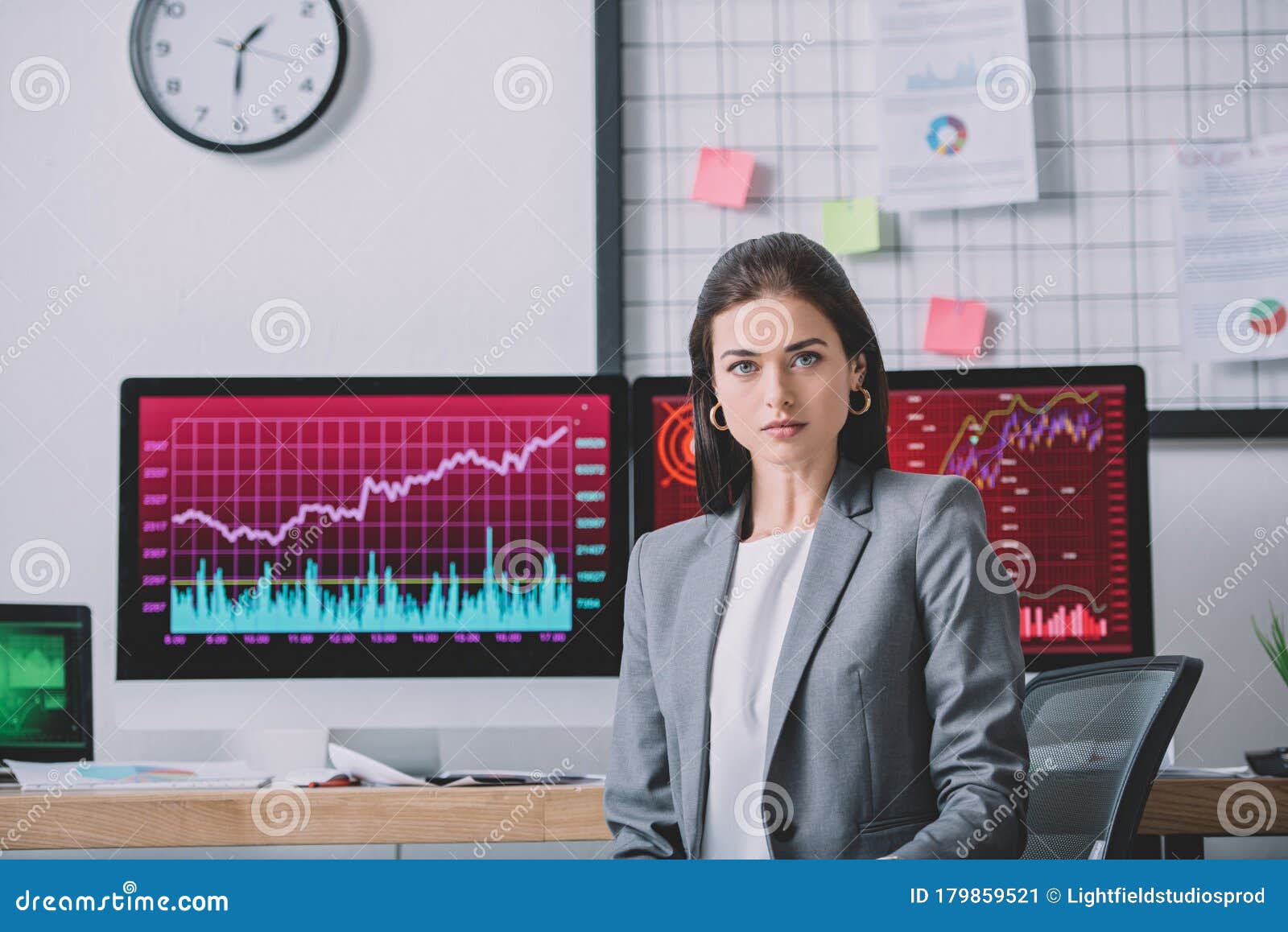 Beautiful Data Analyst Looking at Camera Near Charts Stock Image ...