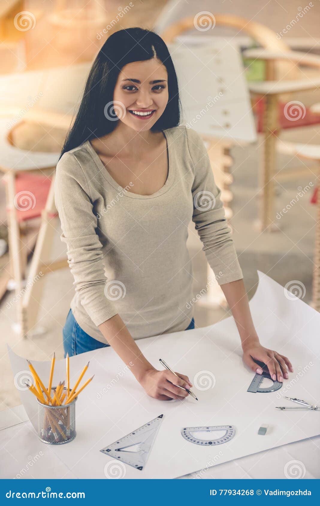 Beautiful designer working stock photo. Image of paper - 77934268