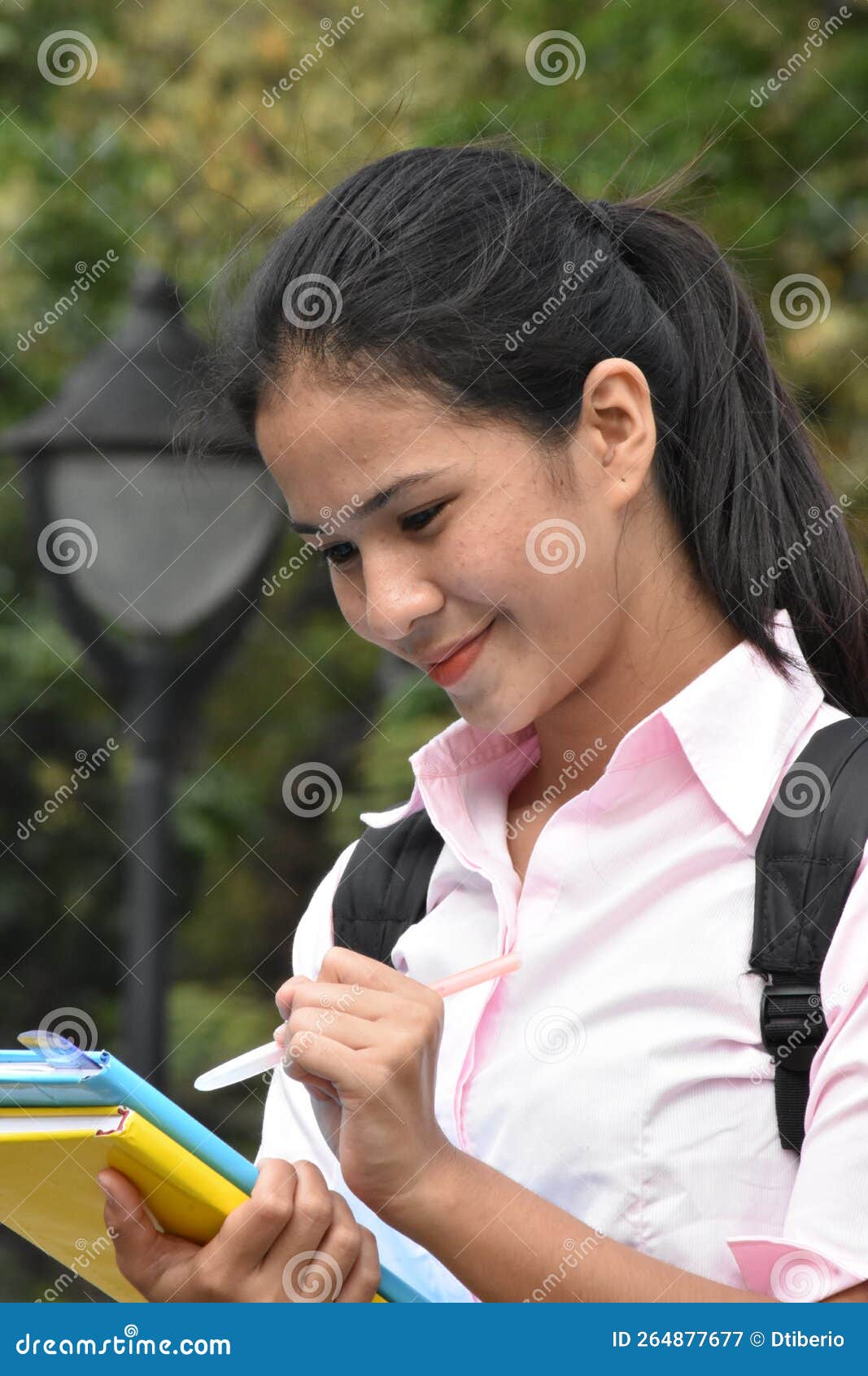 Beautiful Diverse Female Student Writing with Notebooks Stock Image ...