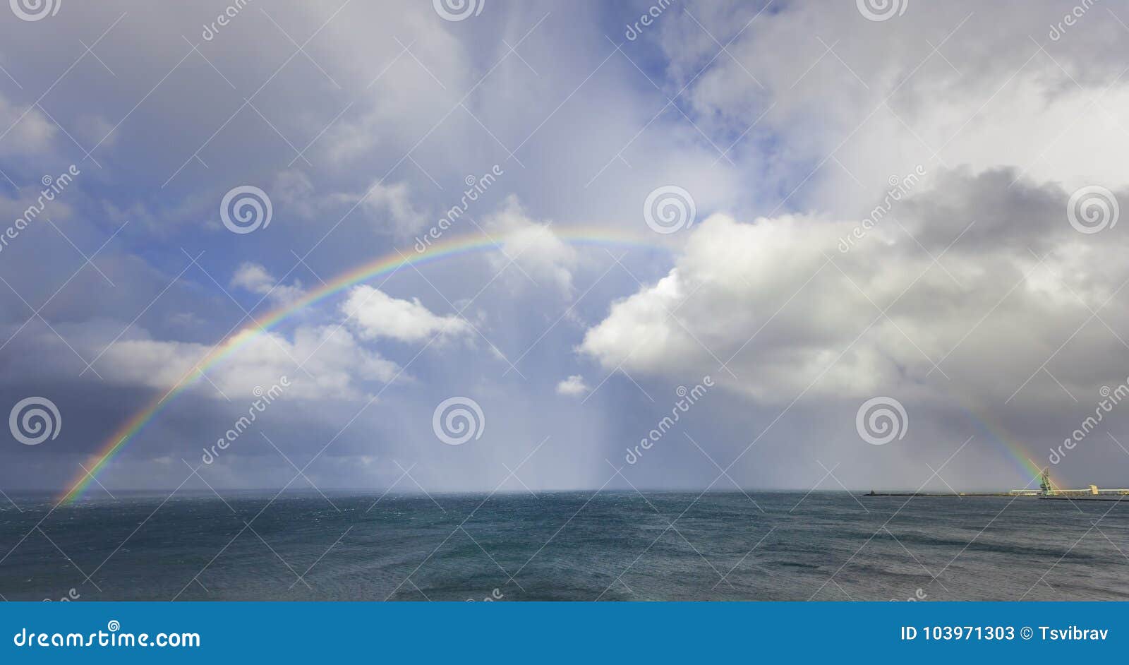 Beautiful Double Rainbow Over Ocean Water with Storm Clouds in the Sky ...