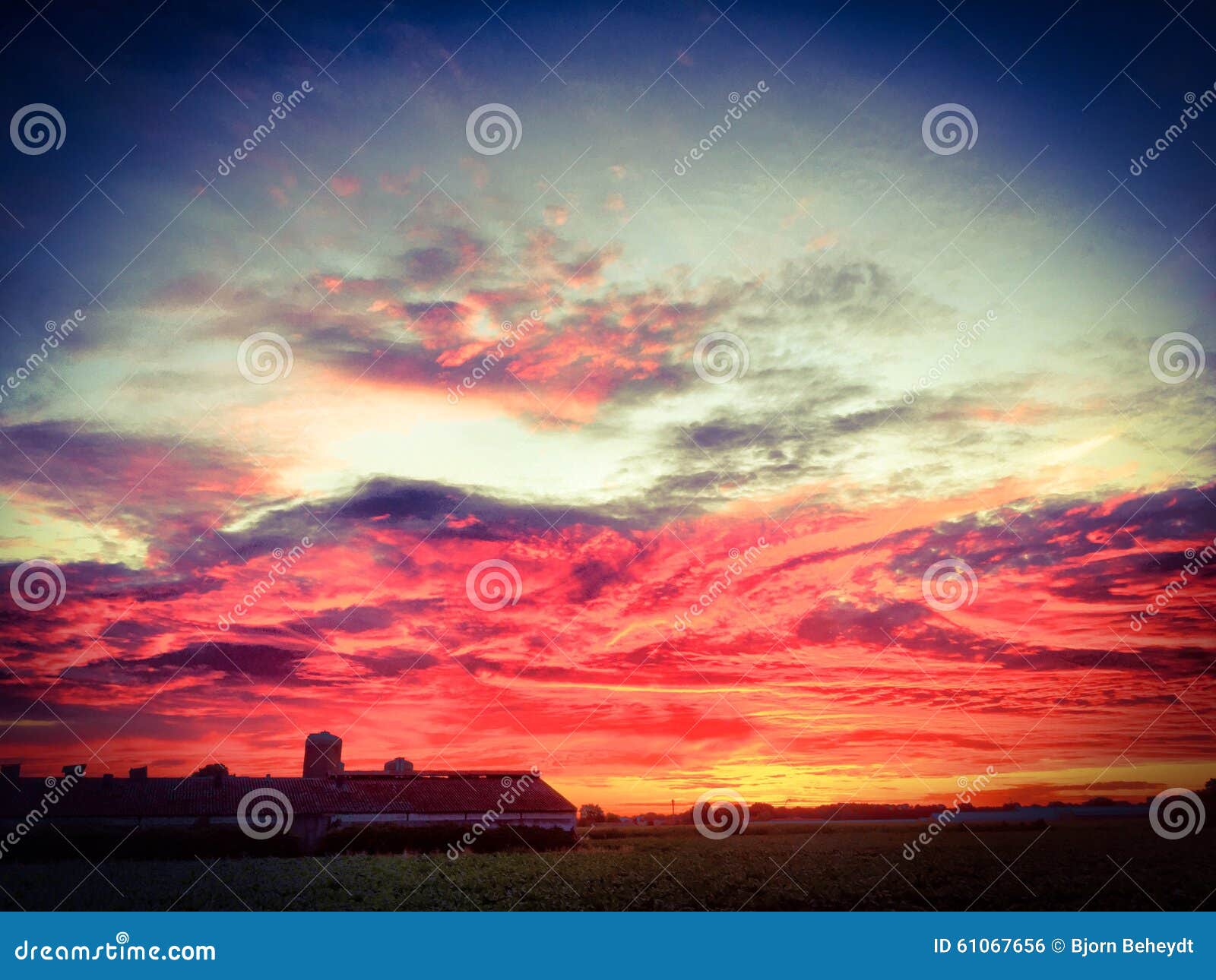 Beautiful Dramatic Sunset Over a Field Stock Photo - Image of field ...
