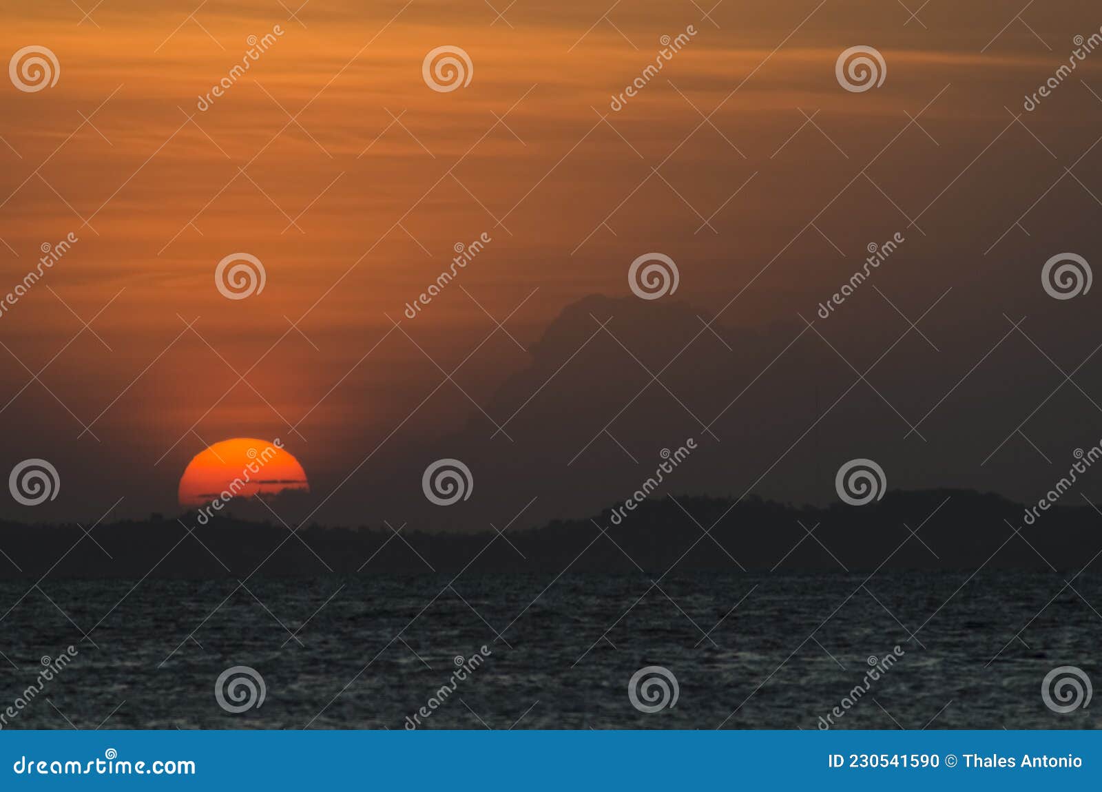 Beautiful Dramatic Yellow and Orange Sunset Falling Behind the ...