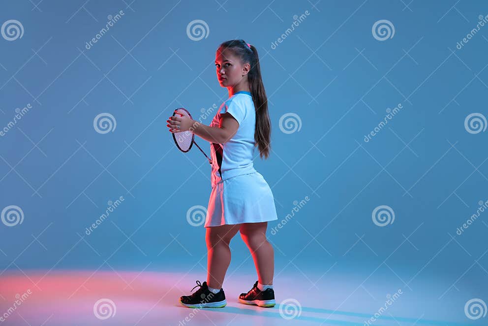 Beautiful Dwarf Woman Practicing In Badminton Isolated On Blue
