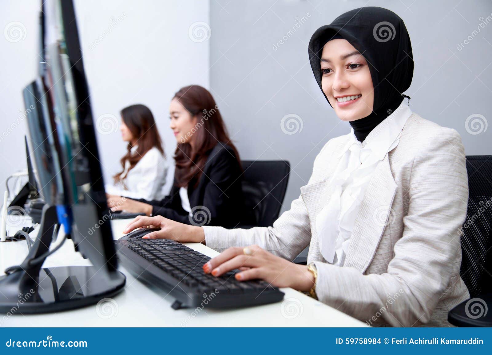 Beautiful Employee Smiling while Working at Office Stock Photo - Image ...