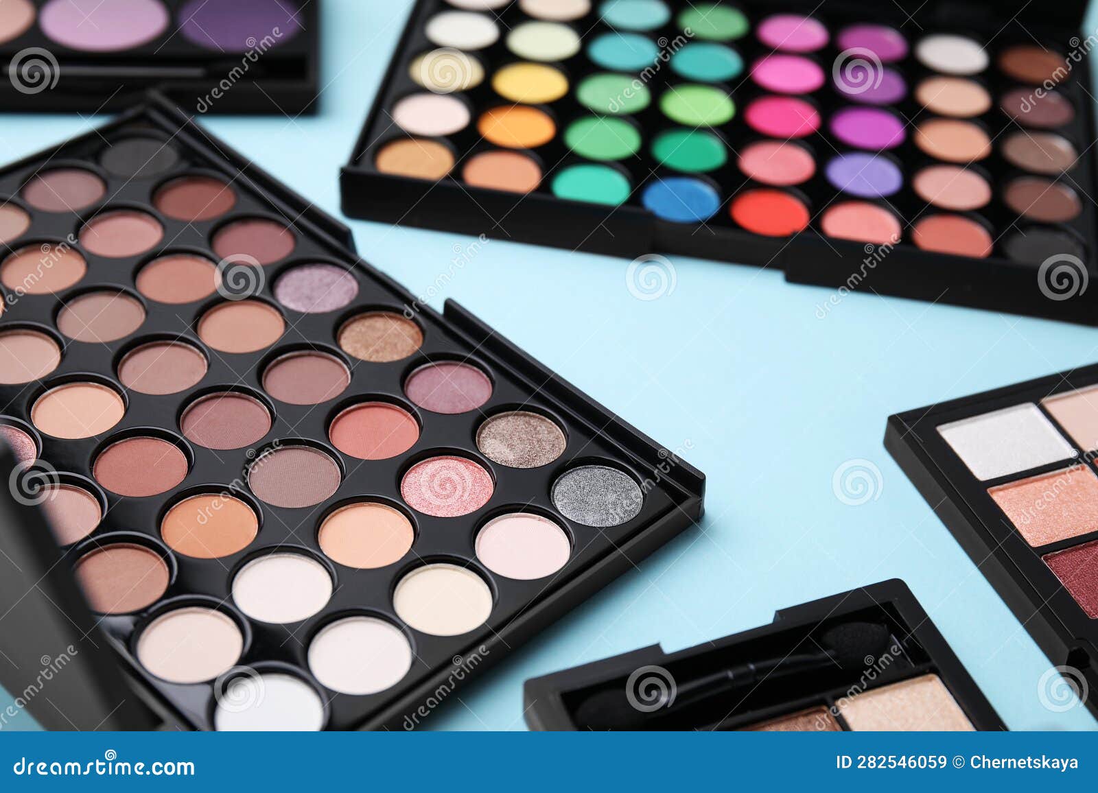 Beautiful Eye Shadow Palettes on Light Blue Background Stock Image ...