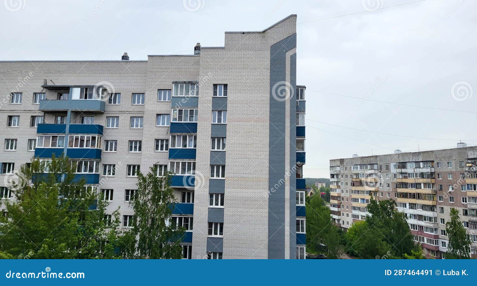 Beautiful Facade of a Brick House with Balconies and a High Sharp Angle ...