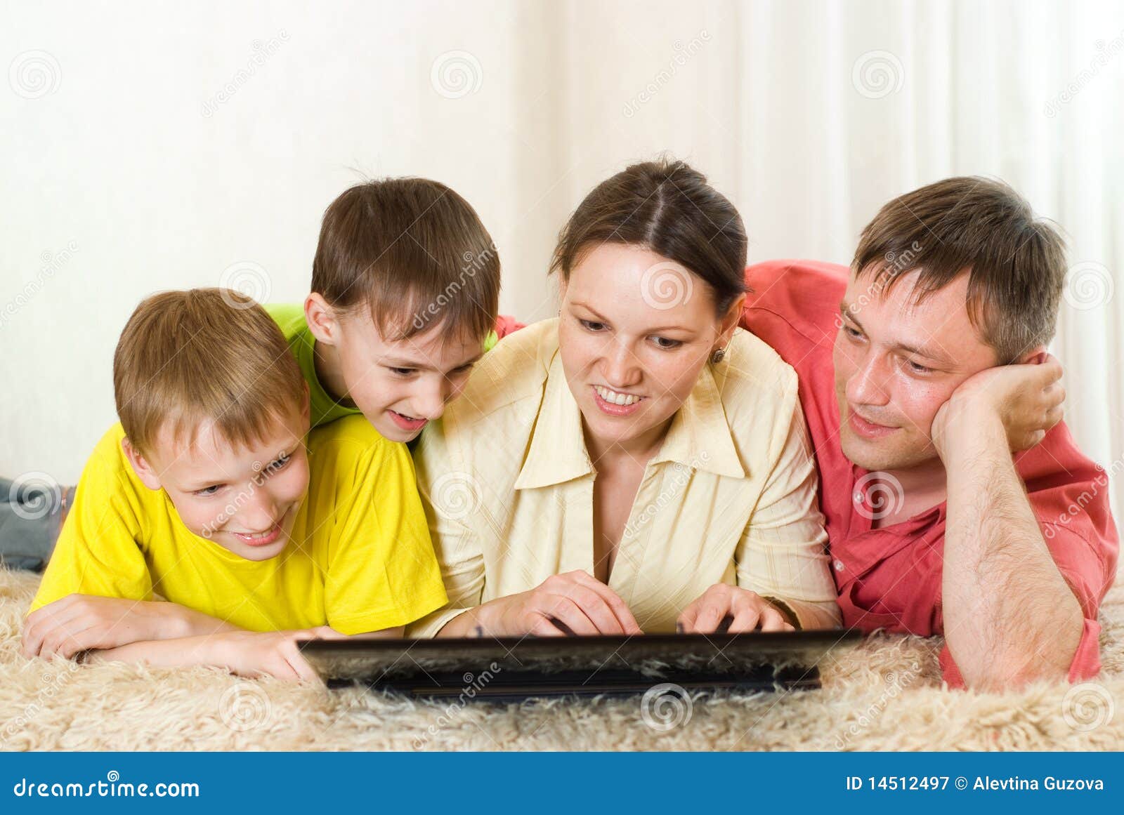 Beautiful Family of Four with a Laptop Stock Image - Image of computer ...