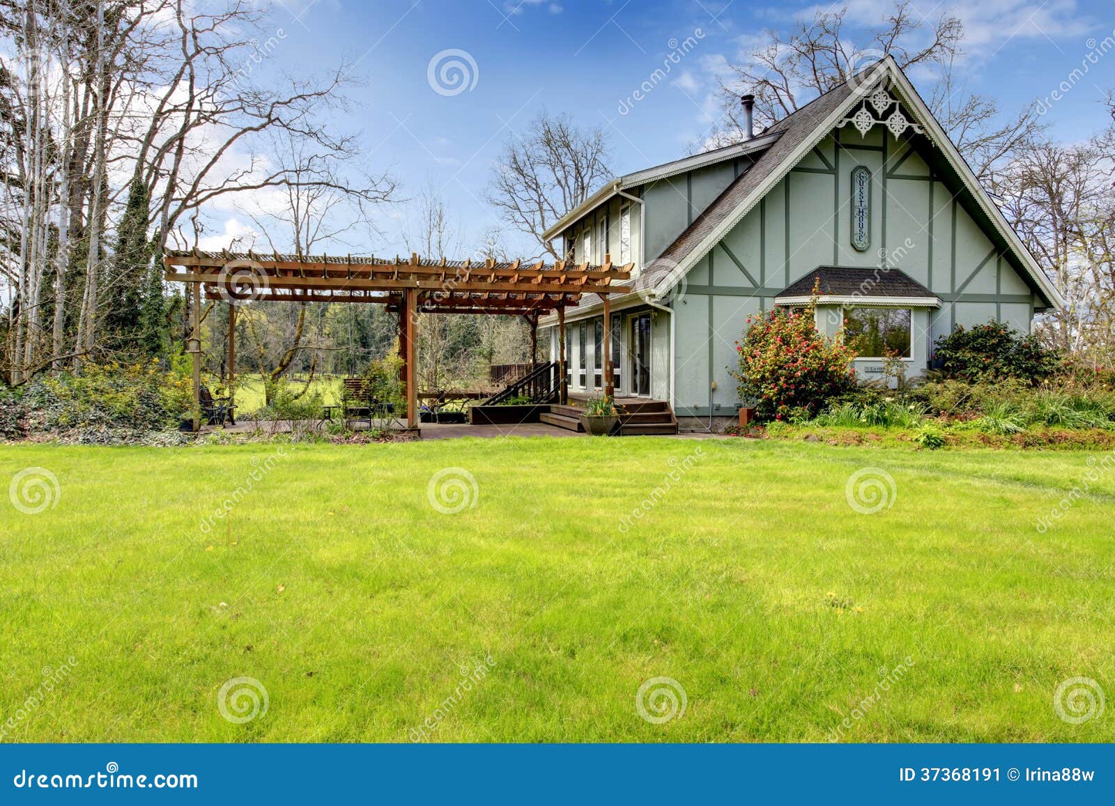 Beautiful Farmhouse with Attached Pergola. Early Spring Stock Image ...