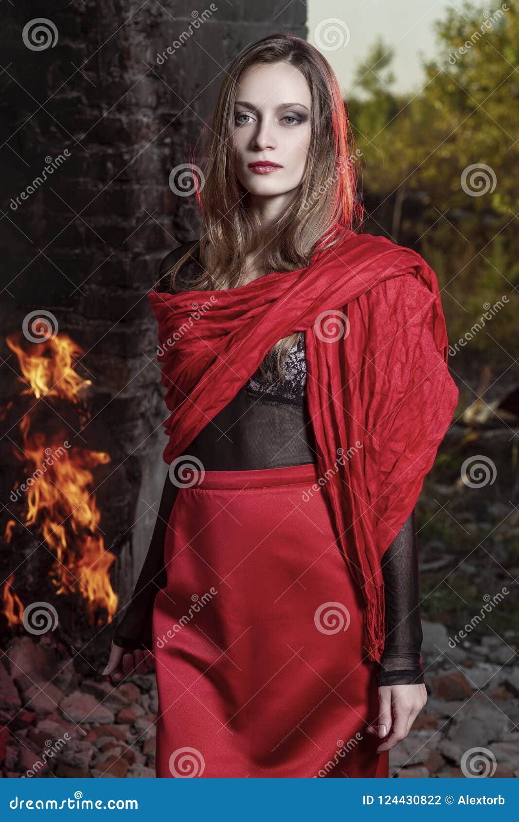 Beautiful Fashion Model Girl Wearing A Red Long Skirt And A Red Stock