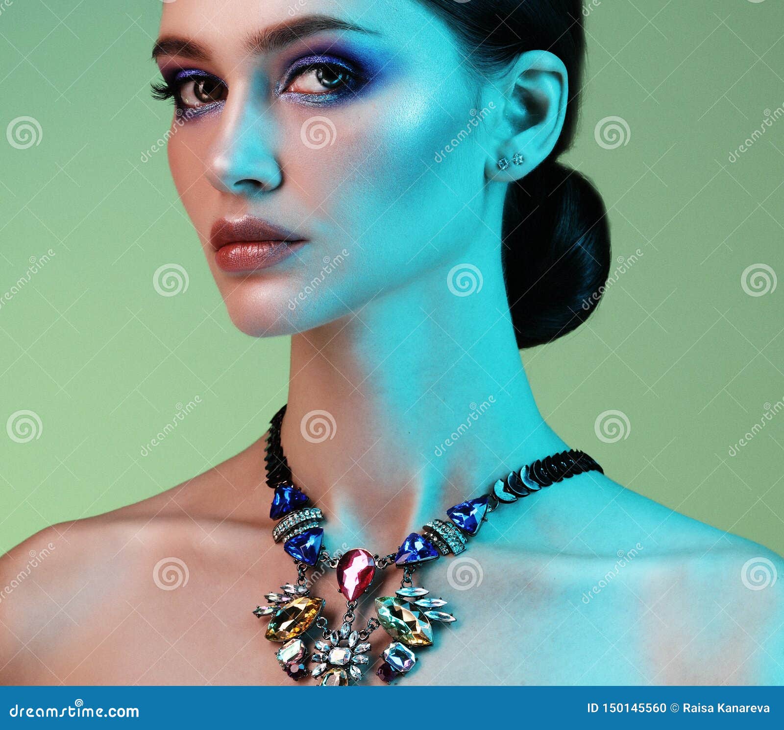 Beautiful Fashion Model Wearing Elegant Jewelry In Color Light Stock
