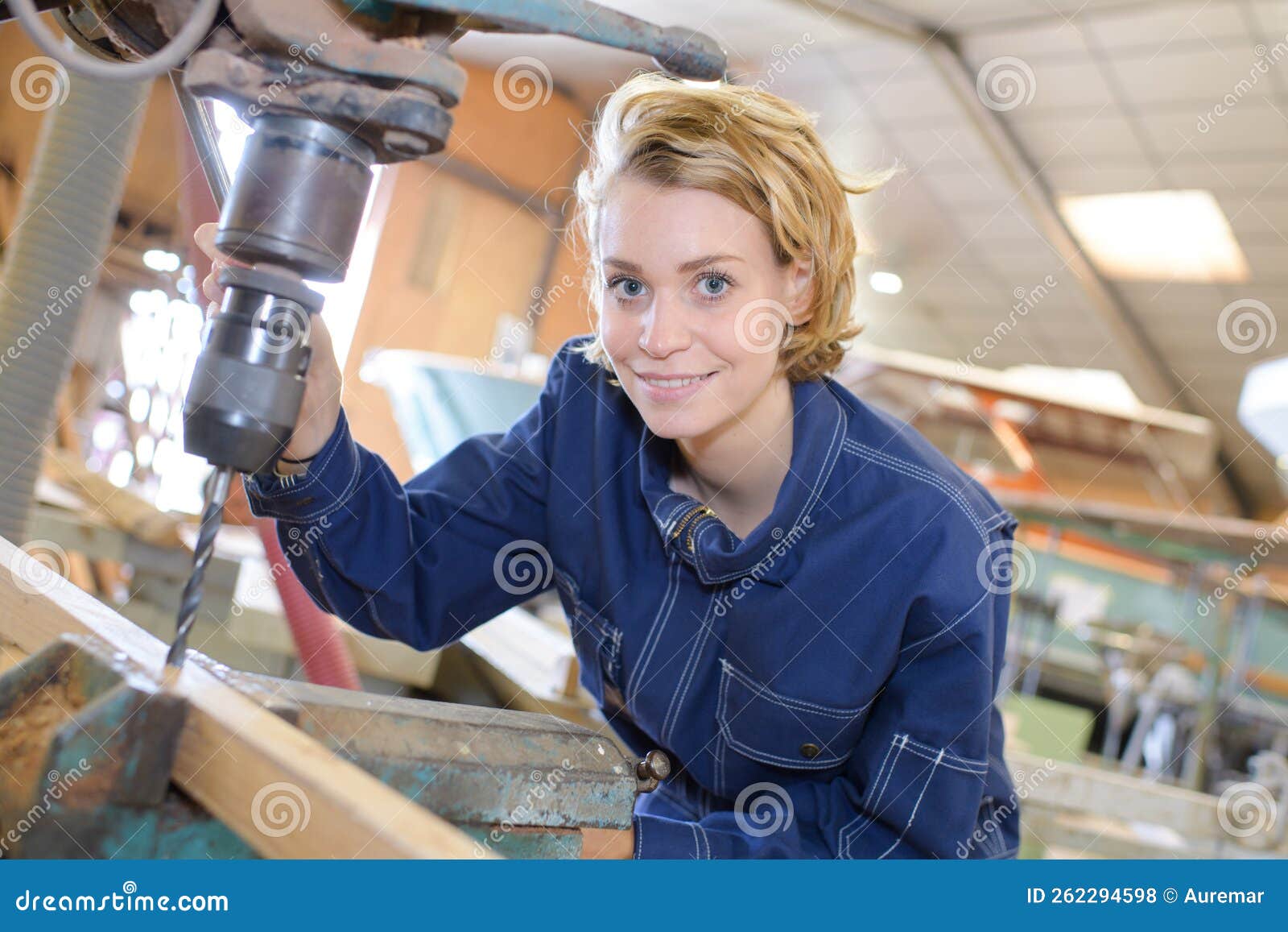 Beautiful Female Carpenter at Work Using Vertical Drilling Machine ...