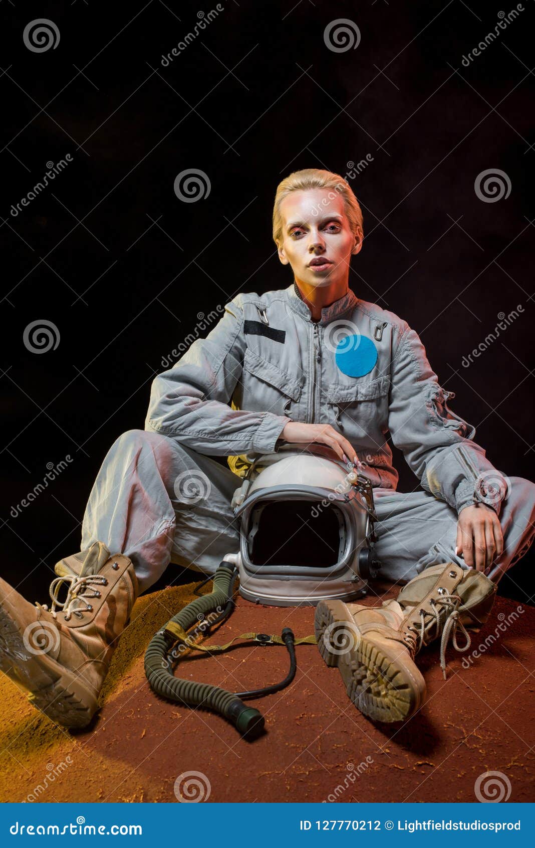 Beautiful Female Cosmonaut in Spacesuit Holding Helmet and Sitting ... Beautiful Female Cosmonaut in Spacesuit Holding Helmet and Sitting ...