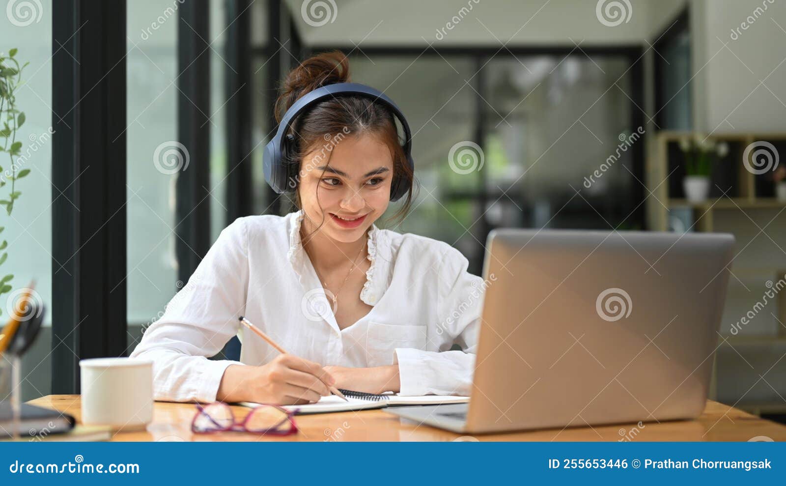 Beautiful Female Employee Using Laptop Computer at Bright Modern ...