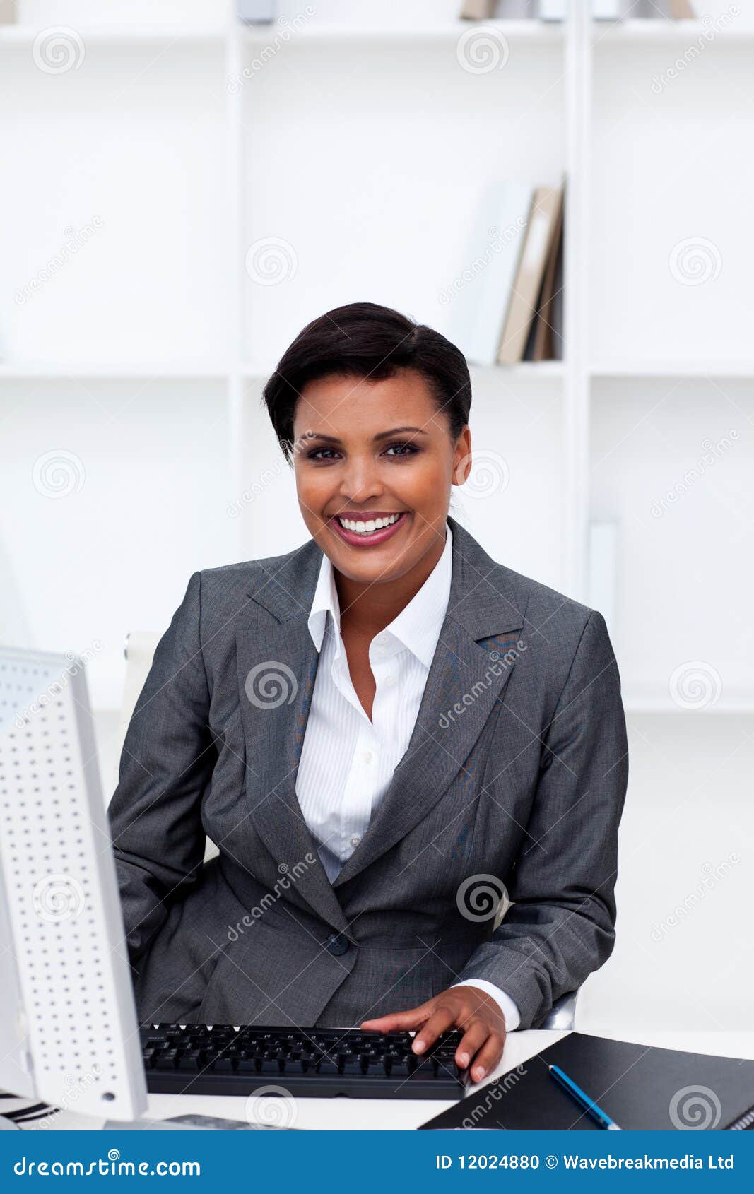 Beautiful Female Executive Working at a Computer Stock Photo - Image of ...