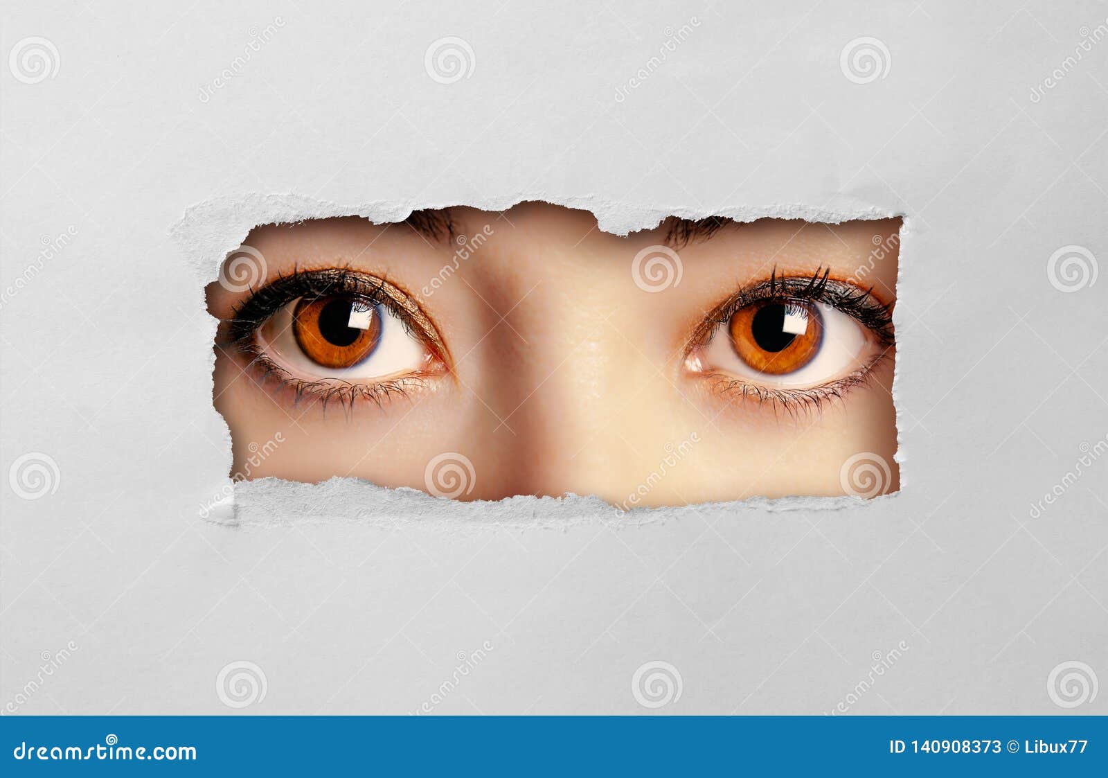 Beautiful Female Eyes Looking through a Hole Cardboard Stock Image ...