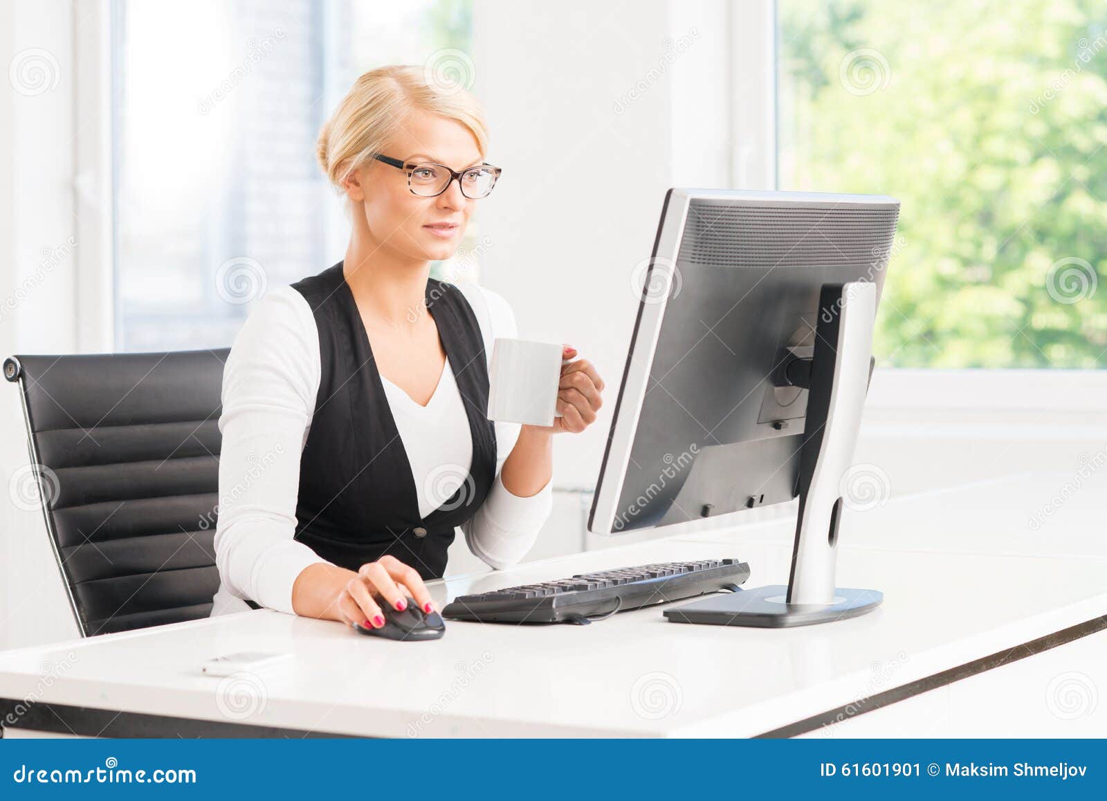 Beautiful Female Office Worker Having a Break by the Computer Having a ...